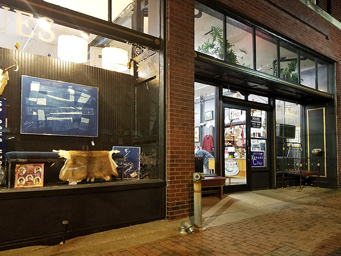 As evening approaches, the illuminated storefront glows like a treasure chest, promising vintage adventures for tomorrow's visitors to this Kansas City institution.