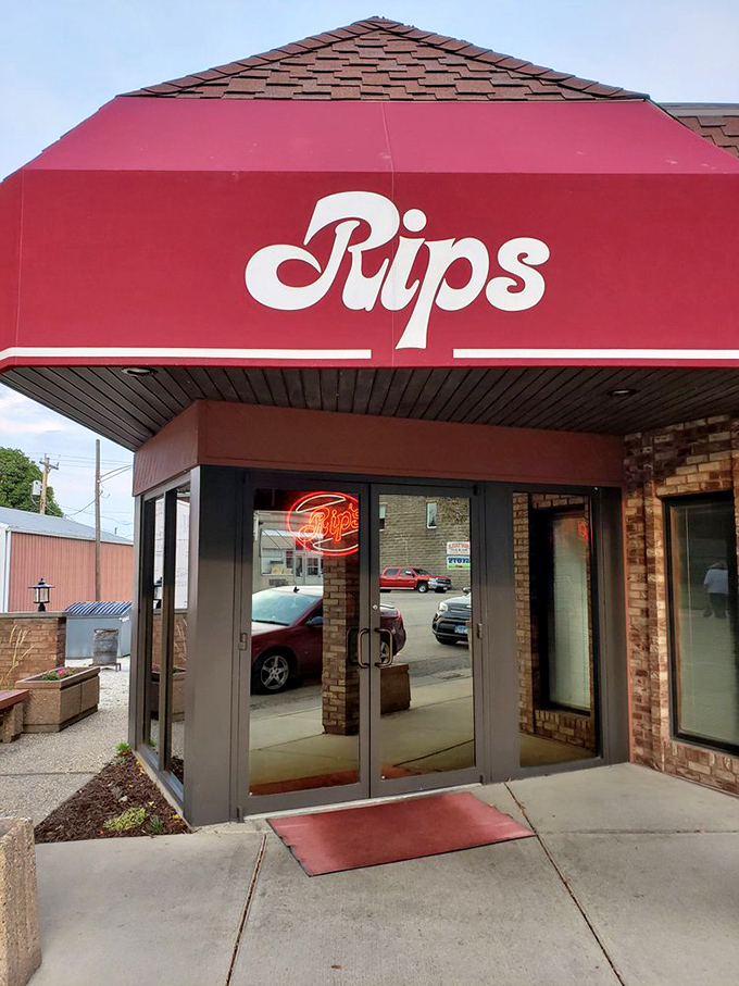 That red awning entrance has welcomed generations of hungry pilgrims. Some things in life are worth the drive&mdash;this doorway leads to one of them. 
