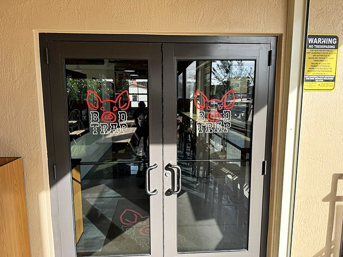 The entrance to meat paradise. That logo isn't just branding—it's a promise that's kept with every smoky, succulent bite inside.