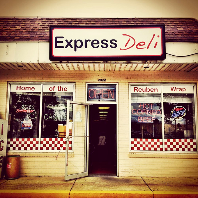 Not all heroes wear capes&mdash;some have "OPEN" signs and "HOT CORNED BEEF" in neon. This entrance promises more satisfaction than most fancy restaurants.