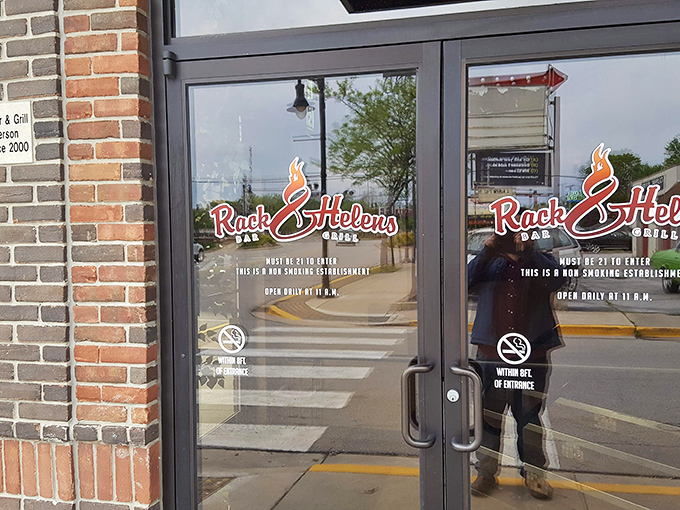 "Must be 21 to enter" &ndash; three words that signal adult pleasures await. The reflection captures both the restaurant and the anticipation of what's inside.