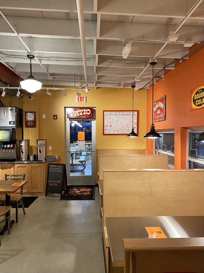 Warm wooden booths, cheerful walls, and the promise of chicken glory. The path to the exit is paved with napkins and satisfaction.