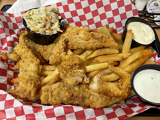 Fish and chips that would make a British pub regular nod in solemn approval. The coleslaw isn't just a side&mdash;it's the referee in this crunchy-creamy matchup.