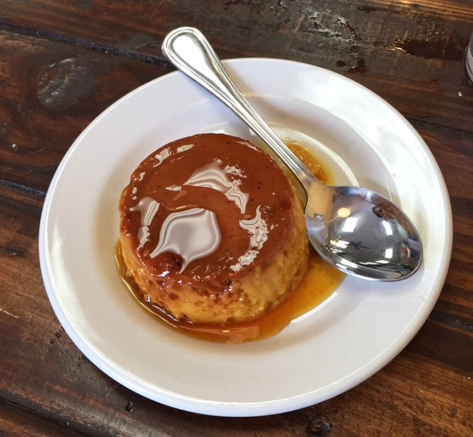 The flan arrives glistening with caramel like it's ready for its close-up&mdash;a jiggly finale to a meal that's already stolen your heart.