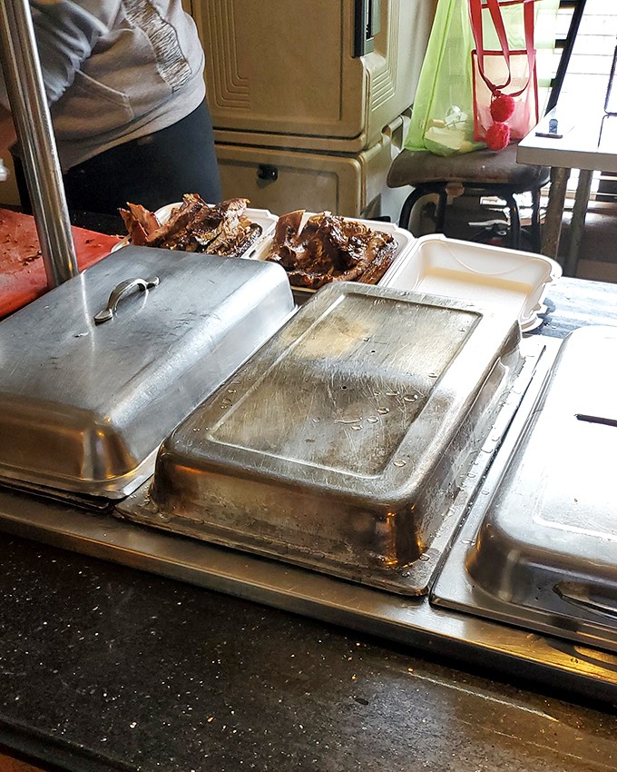 Behind the scenes at barbecue paradise: metal trays holding the day's bounty, ready to satisfy Pittsburgh's most discerning carnivores.