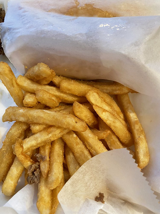 Golden fries nestled in their paper cocoon&mdash;crispy on the outside, fluffy within, and destined for a brief but meaningful existence.