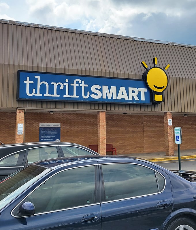 The iconic ThriftSmart sign with its cheerful lightbulb logo brightens Nolensville Pike, beckoning bargain hunters like a thrift store lighthouse.