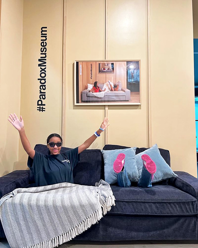 This clever couch installation creates the perfect optical illusion&mdash;making it appear as though you're simultaneously in the photo and viewing it.