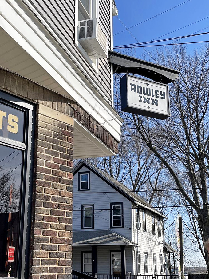 The iconic hanging sign serves as a beacon for hungry travelers and locals alike, promising good times and even better food just beyond the threshold.