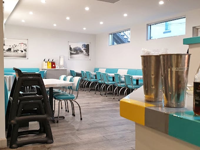 Clean lines, comfortable seating, and those signature turquoise accents create the perfect backdrop for the main event: that dream-worthy chicken sandwich.