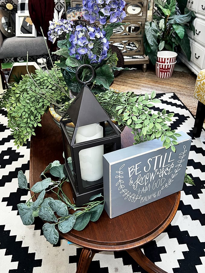 A vignette that perfectly captures the modern farmhouse aesthetic&mdash;where scripture meets greenery and geometric patterns in perfect harmony.