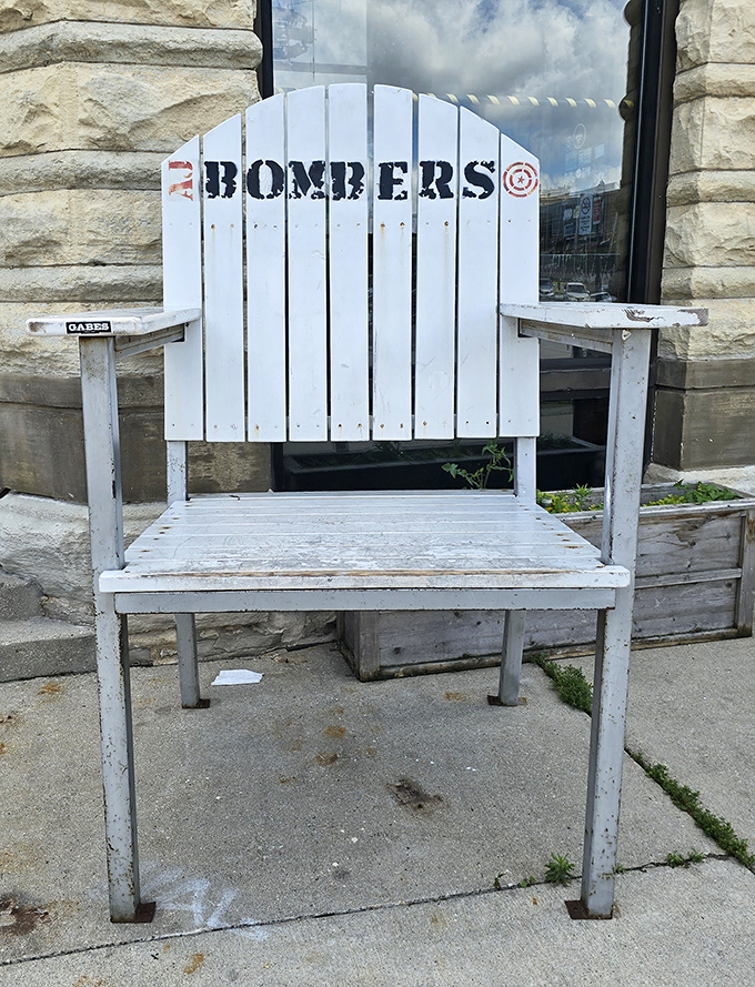 This white Adirondack chair isn't just outdoor seating&mdash;it's a throne for burger royalty, emblazoned with the restaurant's logo for maximum Instagram potential.