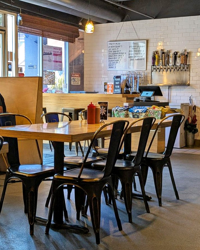 Where BBQ dreams come true, one metal chair at a time. The white subway tiles and wooden accents create the perfect backdrop for meat-induced euphoria.