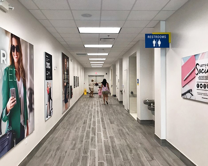 Clean, wide hallways lead to restrooms because even outlet malls understand the importance of pit stops.