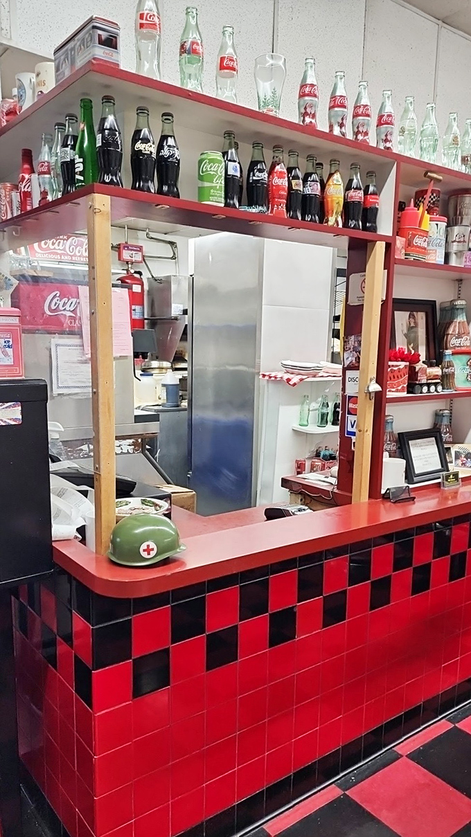 The Coca-Cola collection above the pass-through window proves this place takes its Americana seriously&mdash;right down to the red and black checkered counter.