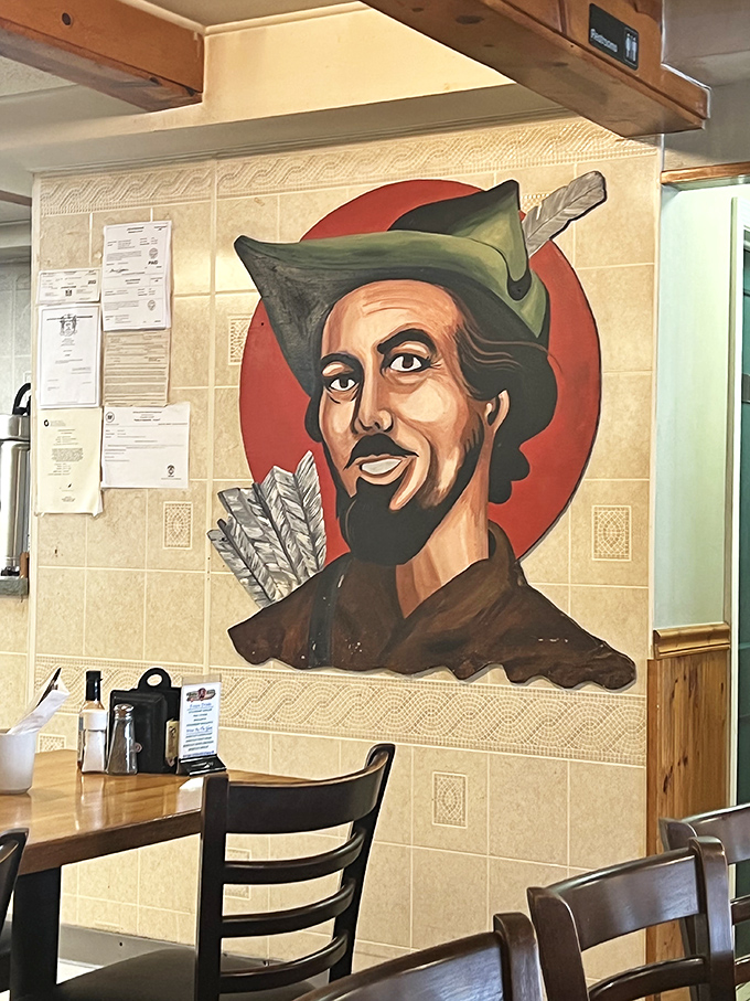 The watchful eyes of Robin Hood himself oversee every plate that leaves the kitchen. This whimsical mural adds character to an already character-filled space.