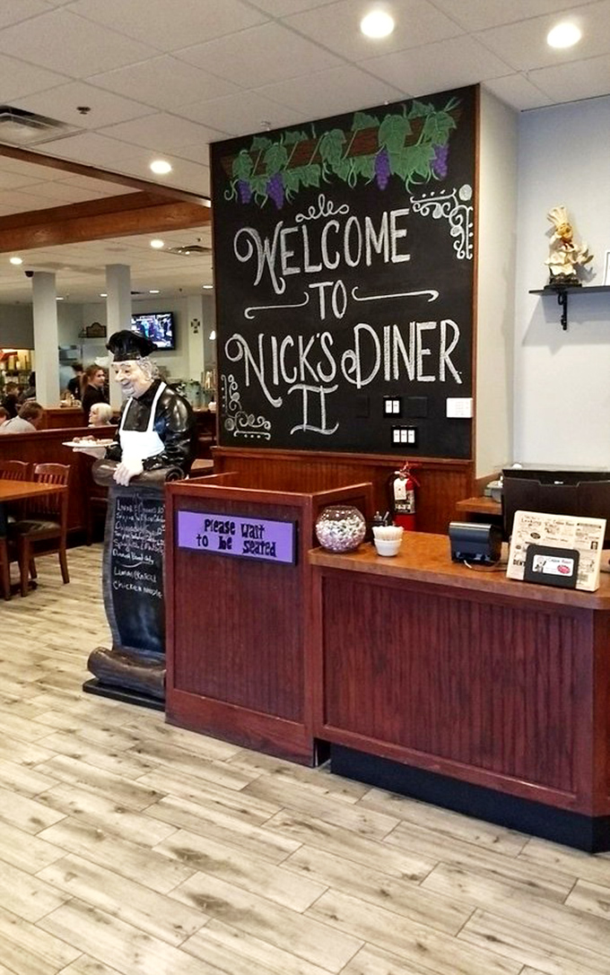 A chalkboard welcome that feels like a hug, where even the "Please Wait to Be Seated" sign seems to add "but we're really glad you're here."