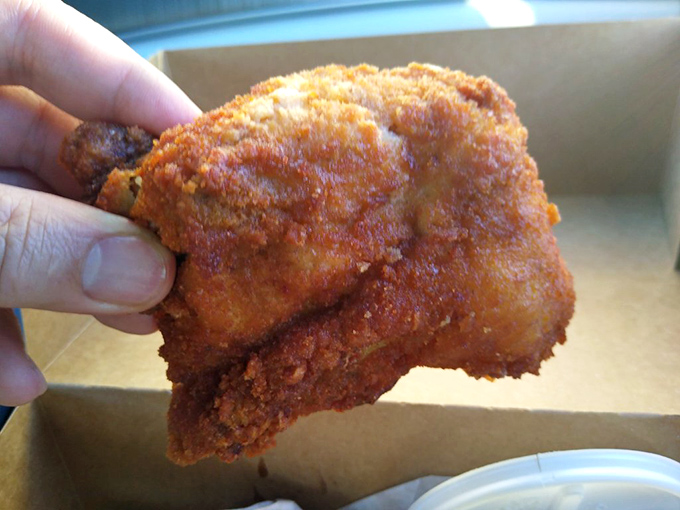 The money shot: perfectly fried chicken with that signature crispy coating. One bite explains why people have been making pilgrimages here for generations.