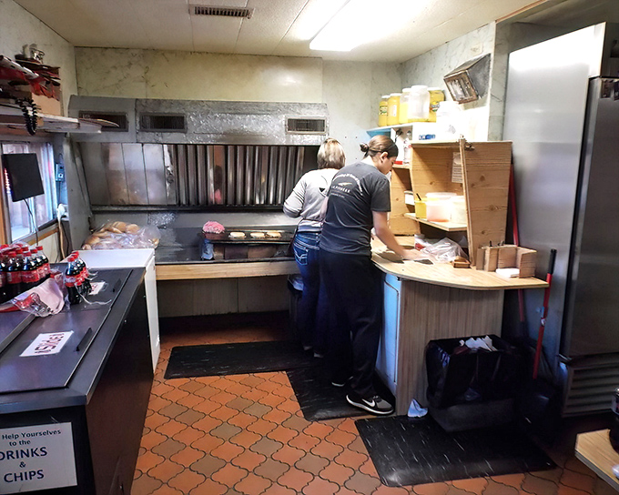 Behind the scenes, the kitchen's modest equipment proves you don't need fancy gadgets to create legendary burgers&mdash;just skill, tradition, and a well-seasoned grill.