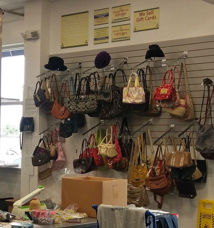 Handbag heaven! Designer lookalikes and occasional authentic treasures hang like fashionable fruit, ripe for the picking.