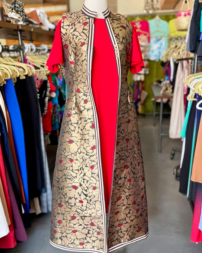 This striking red and patterned ensemble doesn't just enter a room—it makes an entrance worthy of a vintage Hollywood starlet.