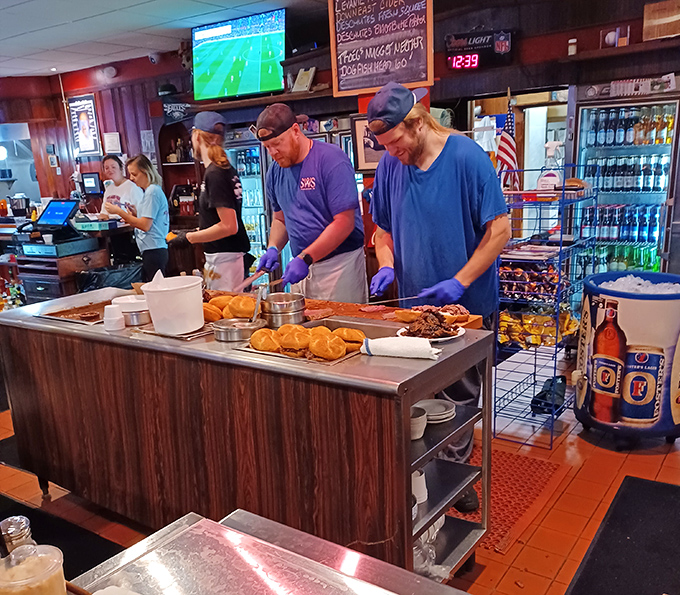 Behind the scenes where the magic happens – three guys turning raw ingredients into local legend status.