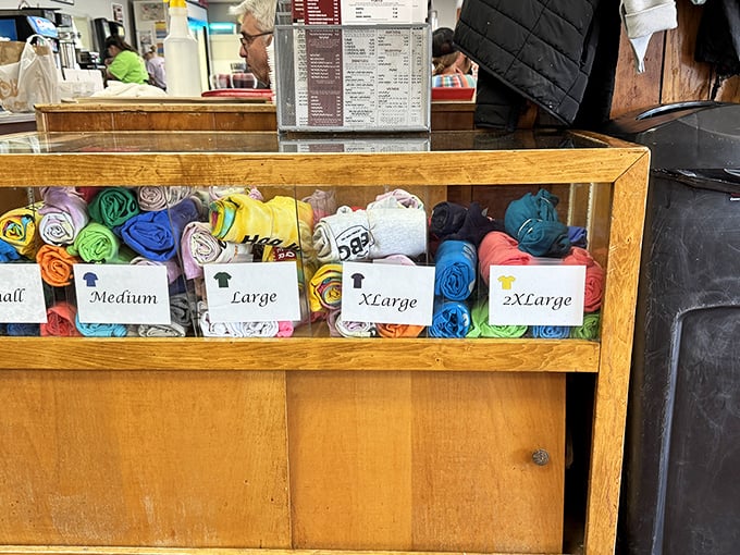 The merch display &ndash; because sometimes you need a souvenir t-shirt to prove you made the pilgrimage to one of North Carolina's barbecue holy lands.