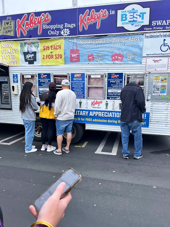 The gateway to bargain hunting begins at the ticket booth. Reusable shopping bags stand ready for the treasures that await inside.