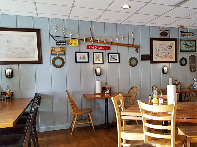Light blue walls and fishing memorabilia create the perfect backdrop for seafood feasts. Those wooden chairs have supported many satisfied customers.