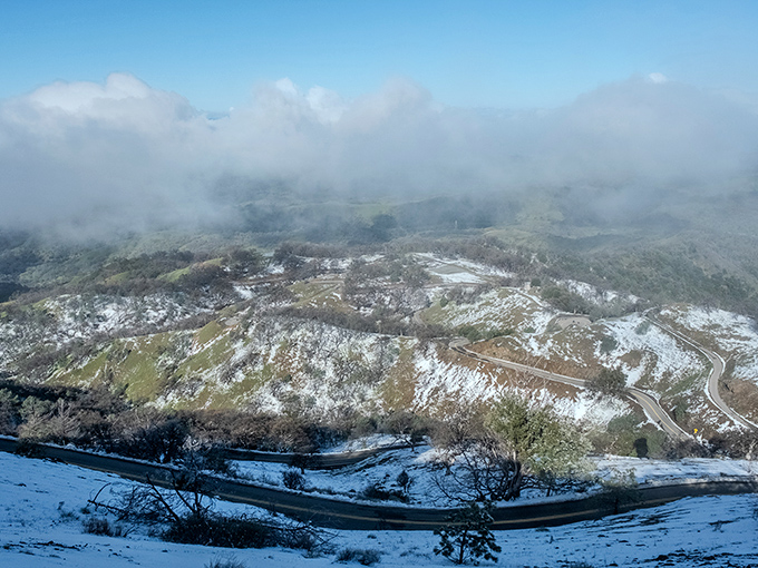 Winter transforms Mount Hamilton into an alpine wonderland. The winding road looks like a ribbon draped across this snowy landscape&mdash;California's own celestial highway.