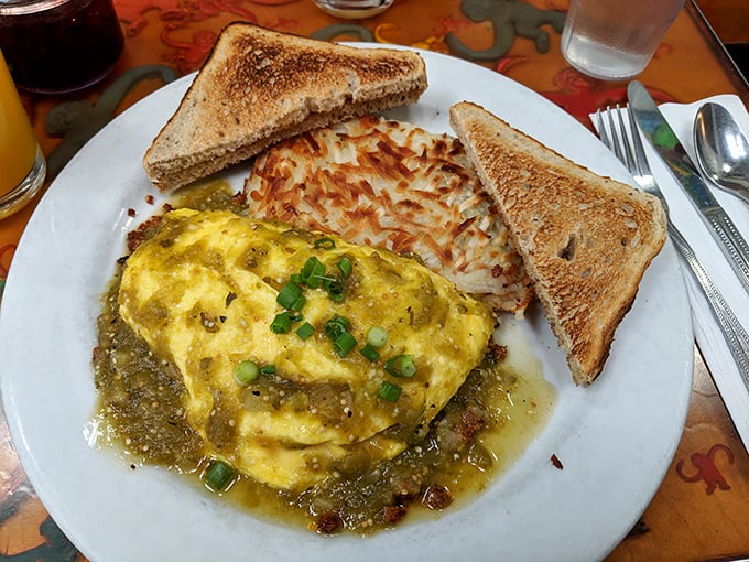This isn't your average omelet&mdash;it's a golden envelope delivering a message of flavor, served with perfectly crispy hash browns and toast.