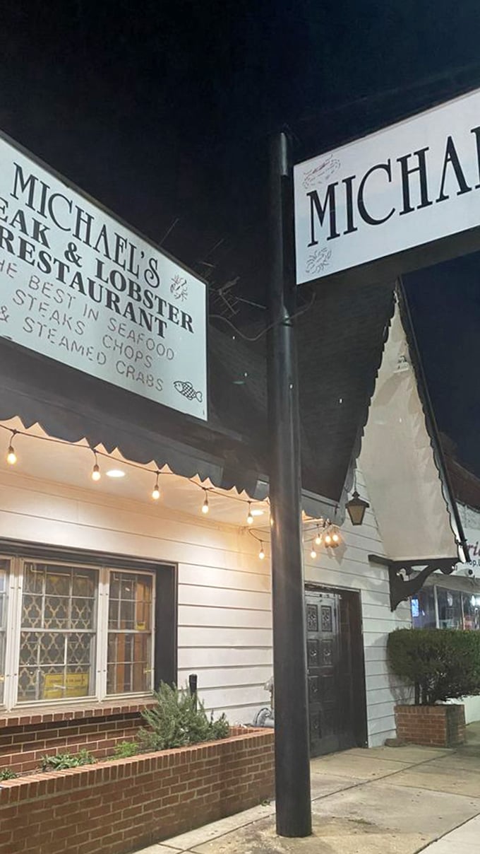 Evening lights transform Michael's exterior into a beacon of culinary promise, like a lighthouse guiding hungry ships safely to port.