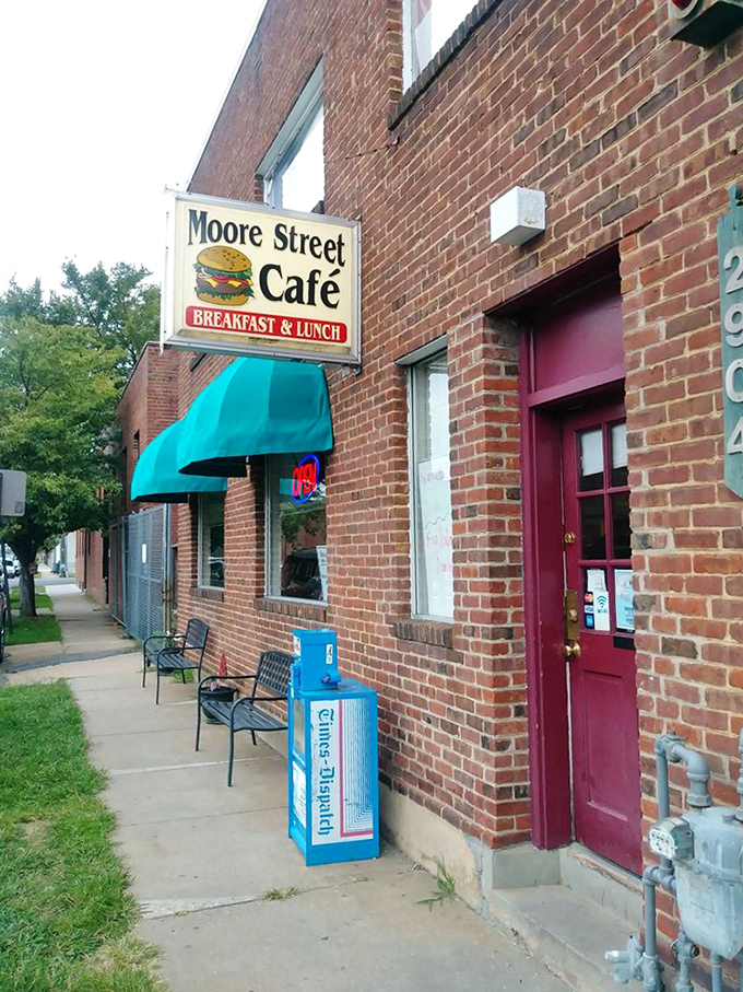 The humble entrance with its teal awning and weathered brick doesn't brag about what's inside&mdash;it doesn't need to.
