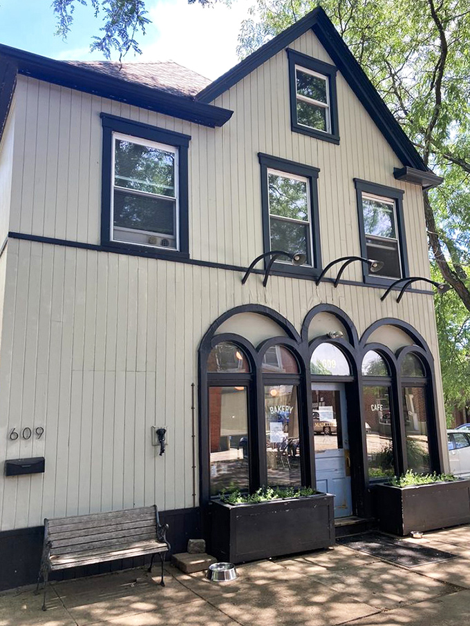 From the outside, you might walk past this unassuming building, never knowing the life-changing pastries waiting just beyond those arched windows.