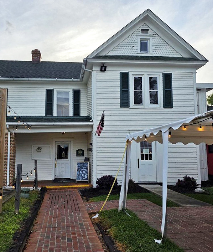 The approach to The Farmhouse feels like discovering a secret&mdash;a white clapboard treasure at the end of a brick path.