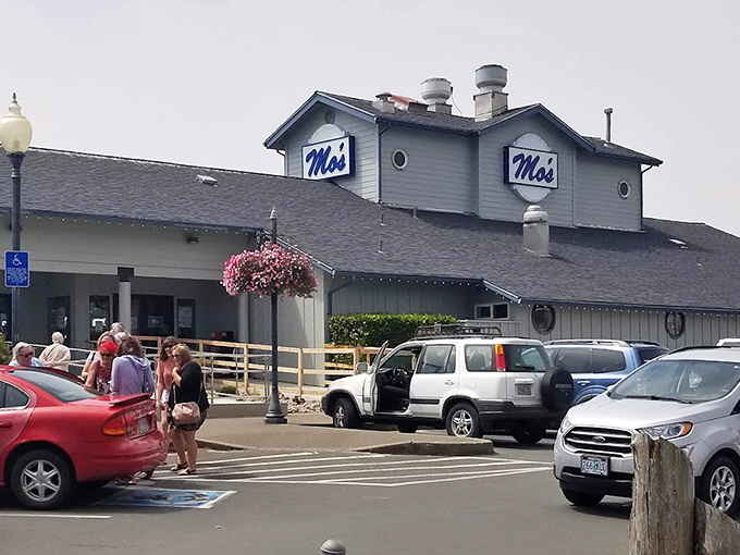 On sunny days, hanging flower baskets add a pop of color to Mo's exterior. The full parking lot tells you everything you need to know about what awaits inside.
