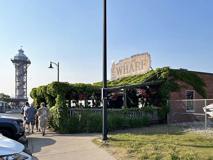 The outdoor deck where vines create nature's own pergola, and every table has a front-row seat to summer.