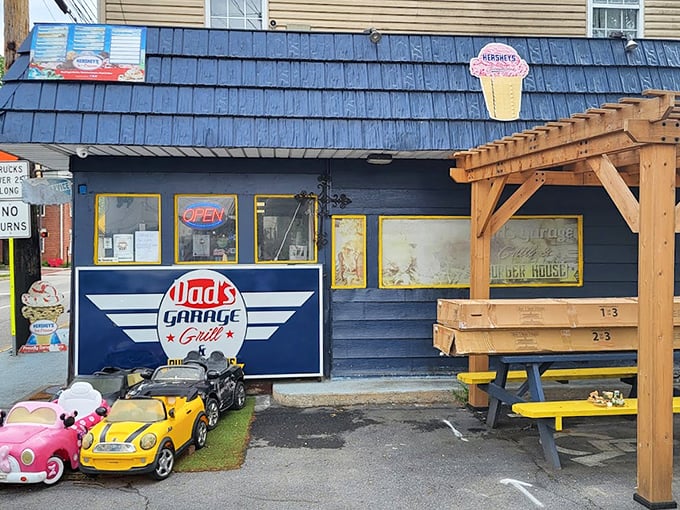 The outdoor seating area, complete with toy cars and picnic tables, where summer memories are made between bites.