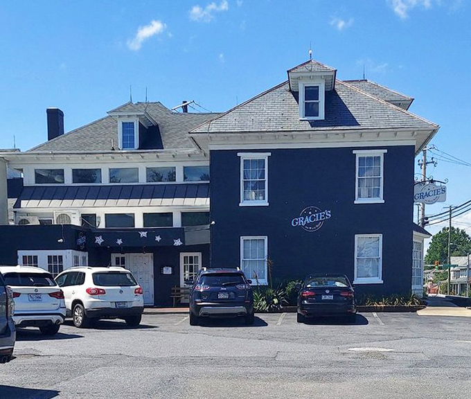 From another angle, the distinctive blue and white exterior of Gracie's stands as a beacon for breakfast pilgrims seeking sandwich salvation.