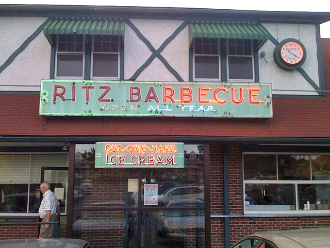 The weathered sign speaks of decades serving the community, with "OUR OWN MAKE ICE CREAM" being perhaps the most beautiful phrase in the English language.