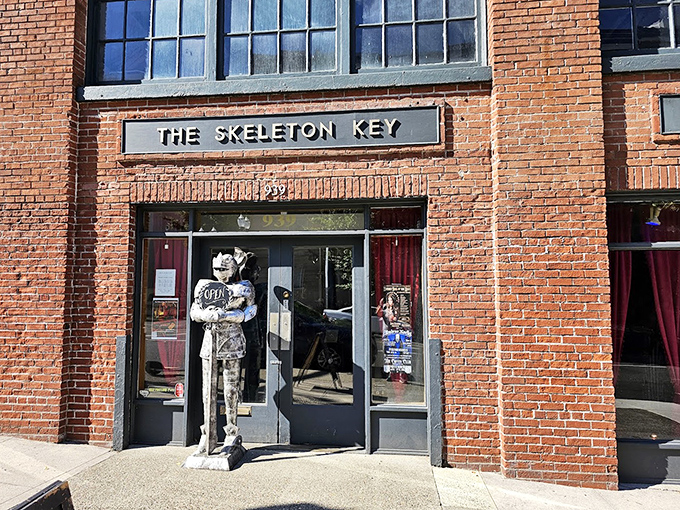 The entrance guardian&mdash;a life-sized statue seemingly made of bones&mdash;stands eternal watch at the doorway, silently judging whether you're curious enough to deserve entry into this realm of oddities.