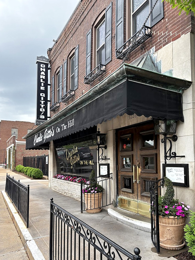Flower boxes and wrought iron details frame the entrance, promising the kind of authentic experience that food dreams are made of.