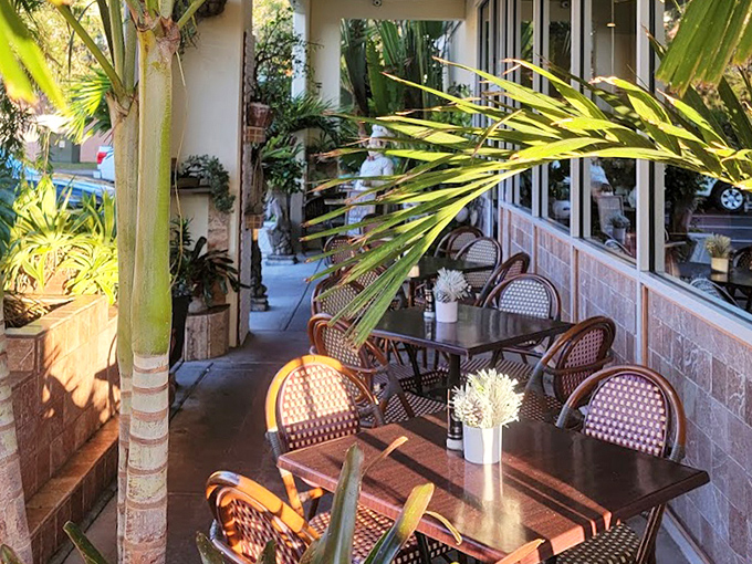 The outdoor seating area offers a tropical oasis for your breakfast&mdash;wicker chairs, palm fronds, and sunshine included at no extra charge.