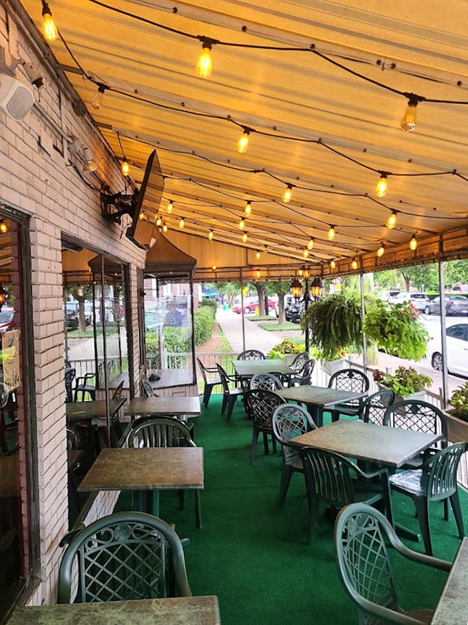 The covered patio offers al fresco dining under twinkling lights, where hanging plants and fresh air enhance every bite of Kelly's famous fare.