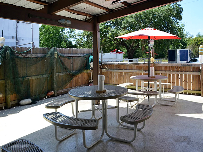 Simple outdoor seating that says, "The fanciest thing here will be the seafood on your plate, exactly as it should be."