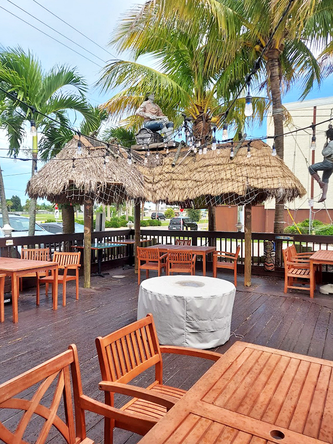 The outdoor dining area&mdash;where palm trees sway, ocean breezes play, and you can pretend you caught that seafood yourself just hours ago.