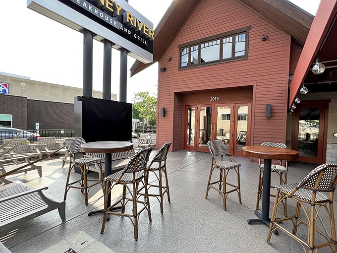 Bistro tables and French-inspired chairs create an outdoor space that says, "Yes, you can have your steak and fresh air too."