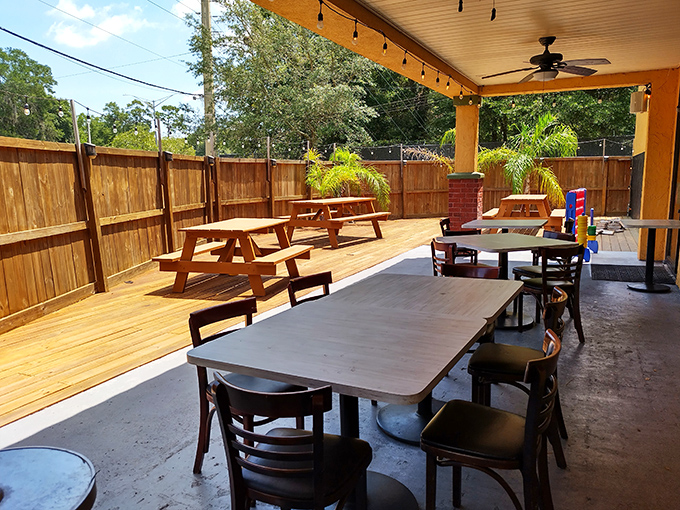 Florida dining at its most authentic &ndash; an outdoor patio where sea breezes, ceiling fans, and cold drinks create the perfect post-beach atmosphere. 