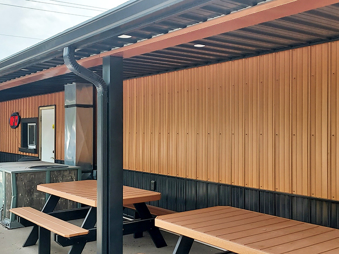 Outdoor seating that's not trying to impress anyone &ndash; just honest picnic tables where the only thing that matters is what's on your tray.