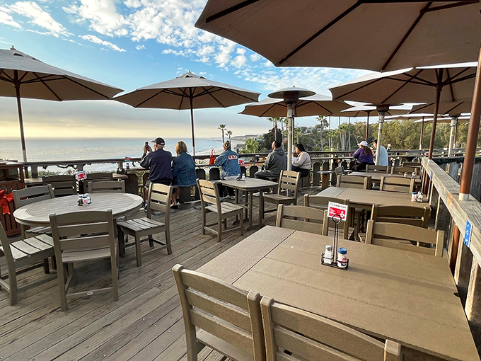 The million-dollar view that comes free with your meal. These umbrella-dotted tables have witnessed countless first dates, family reunions, and "I needed this" moments.